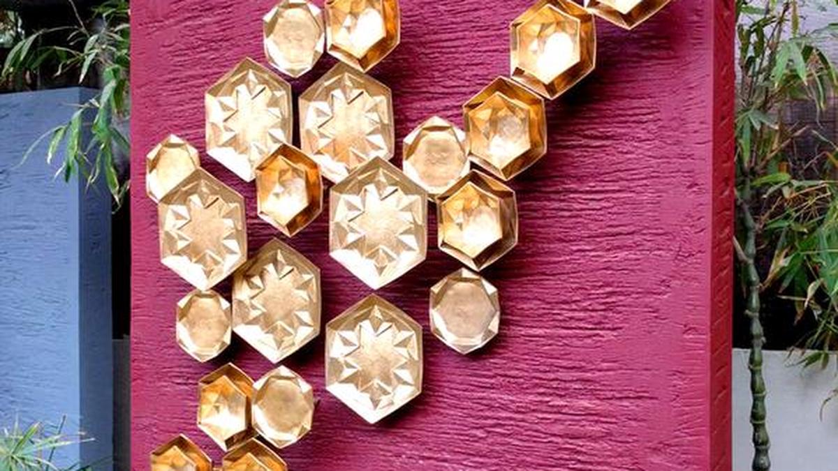 Faceless people, folded metal - The Hindu