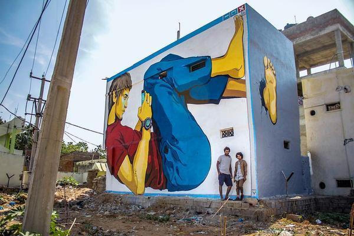 swathi and vijay are on a high paintings on high-rise structures - The ...