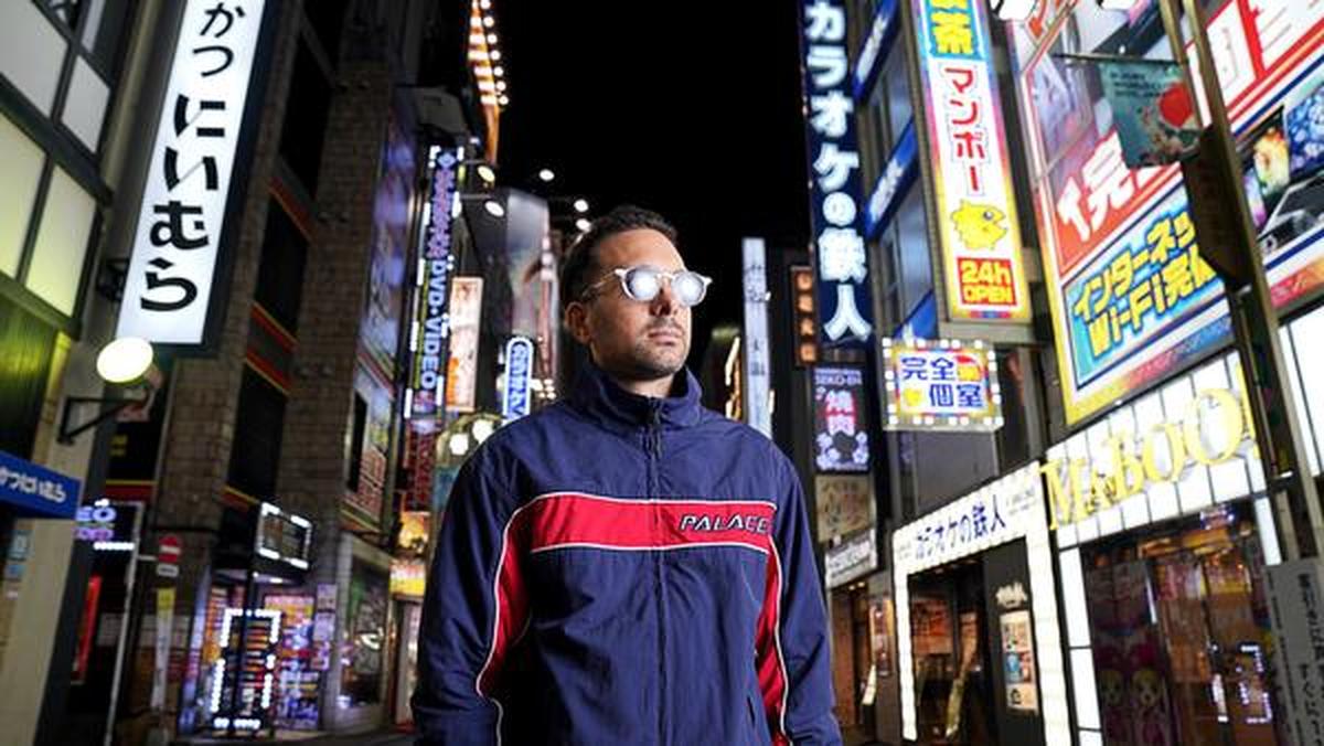 Dynamo Magician Walking Down Building