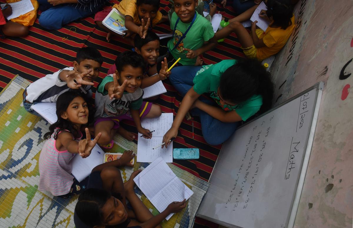 Delhi students teach and play heroes to street children - The Hindu