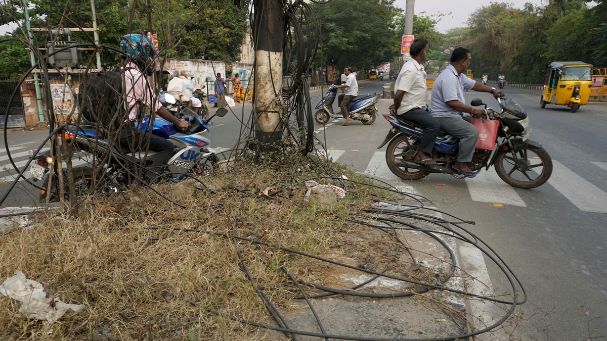 Dangling cables, a threat to residents - The Hindu