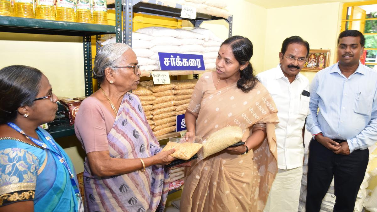 Collector inspects ration shop where provisions are sold in packets ...
