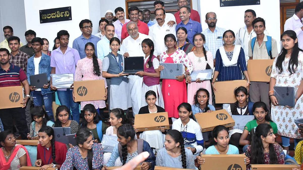 Laptops distributed to 39 girl students - The Hindu