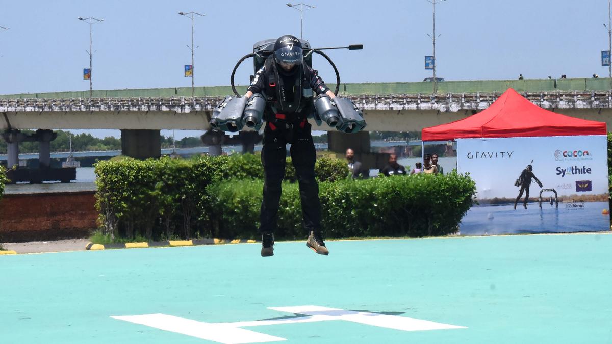 Man in jet suit flies over backwater leaving spectators spellbound ...