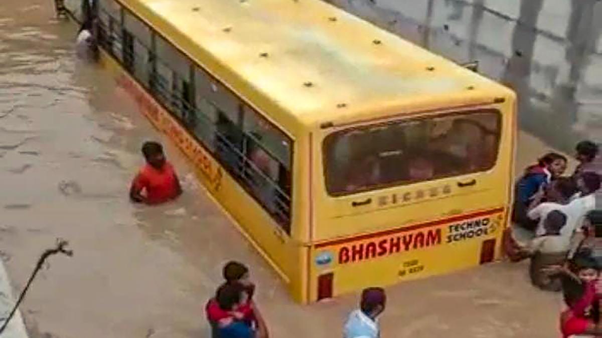 Lucky escape for children as bus caught in flood water - The Hindu
