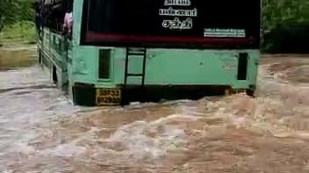 Bus gets stuck in flash flood in forest area in Erode, narrow escape ...