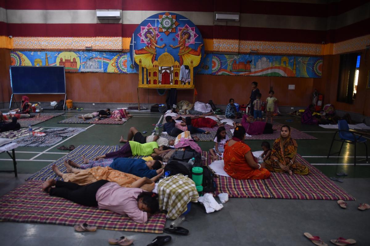 Displaced, people languish along roadsides, under flyovers in Delhi ...