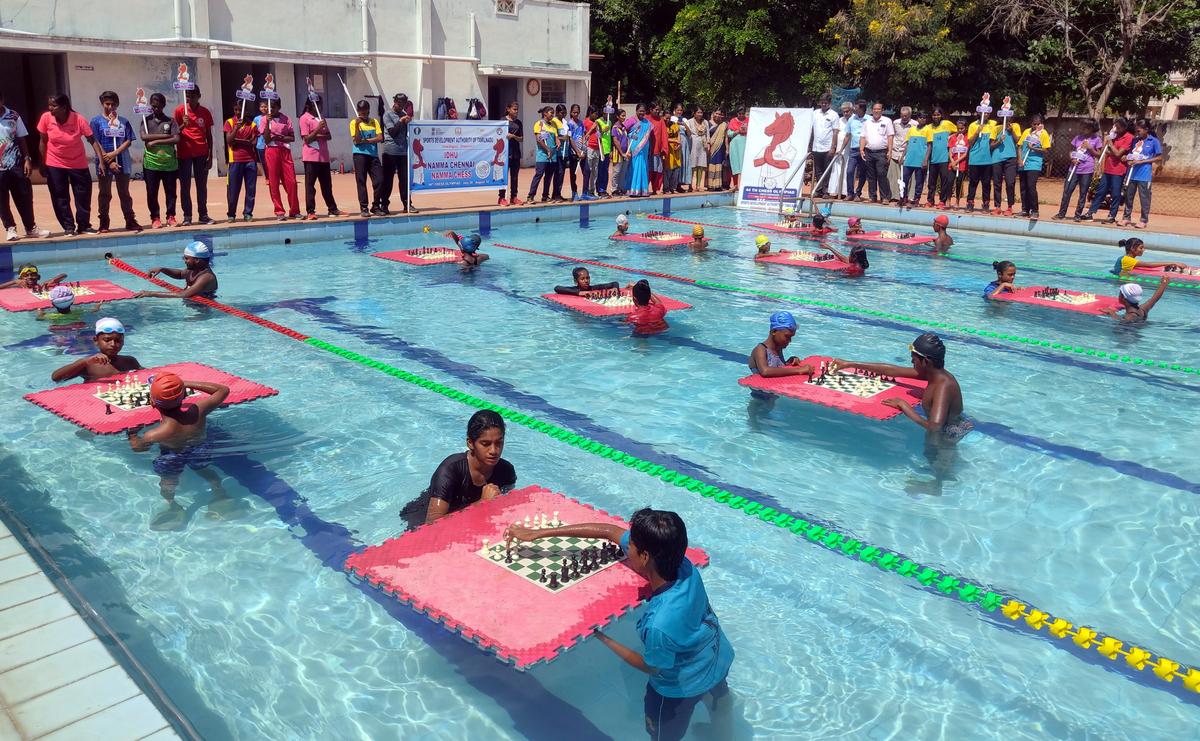 Students play chess in swimming pool - The Hindu