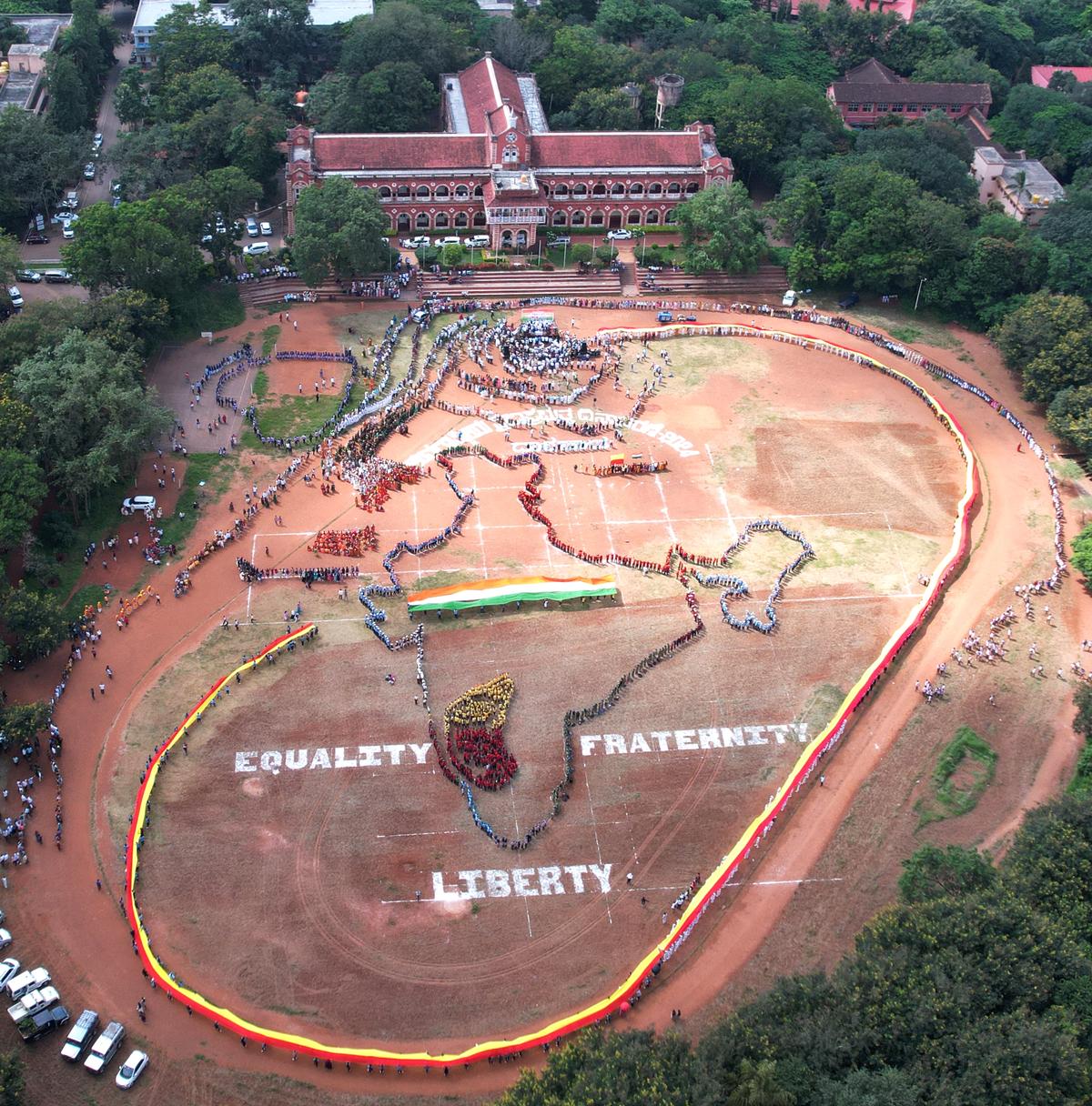 Participants hold hands to form an unbroken human chain across dists ...