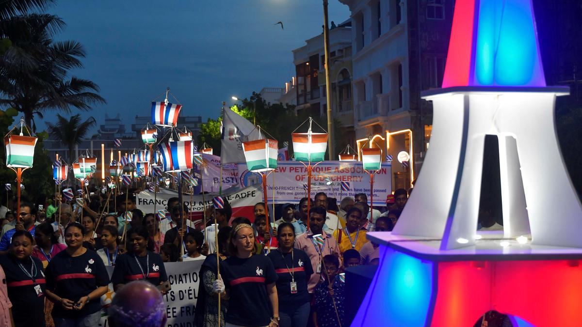 Torch-light march taken out along the Promenade beach on Bastille Day ...
