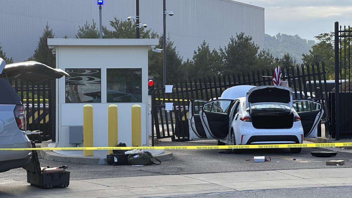 Suspect in custody after driver rams car into FBI building gate in ...