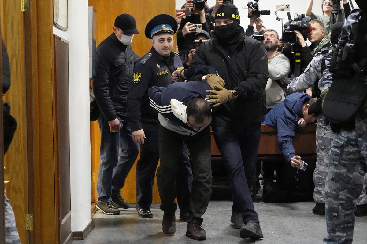 Moscow concert hall shooting | Four men charged in attack, showing signs of beatings at hearing ...