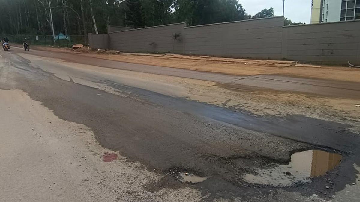 Newly-laid road in Bengaluru develops potholes, citizens allege shoddy ...