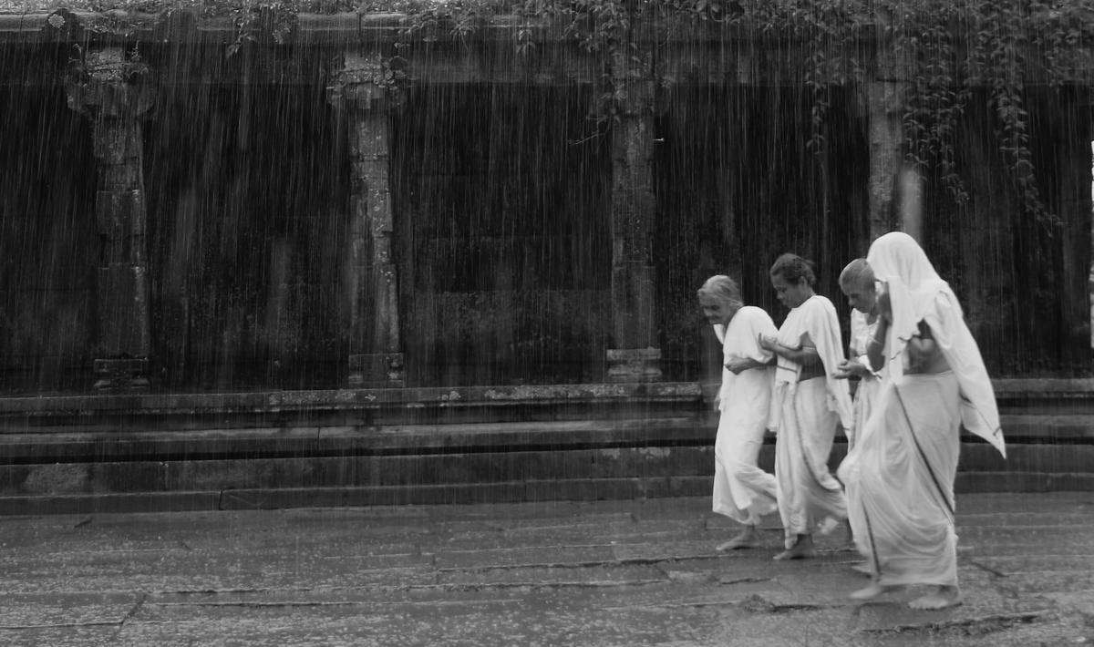 A group of old women circumambulate the Thirunelli temple in Wayanad ...