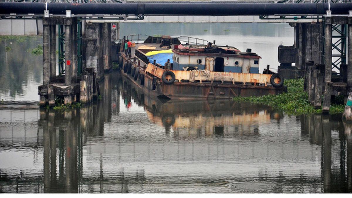 Barge trapped under bridge - The Hindu