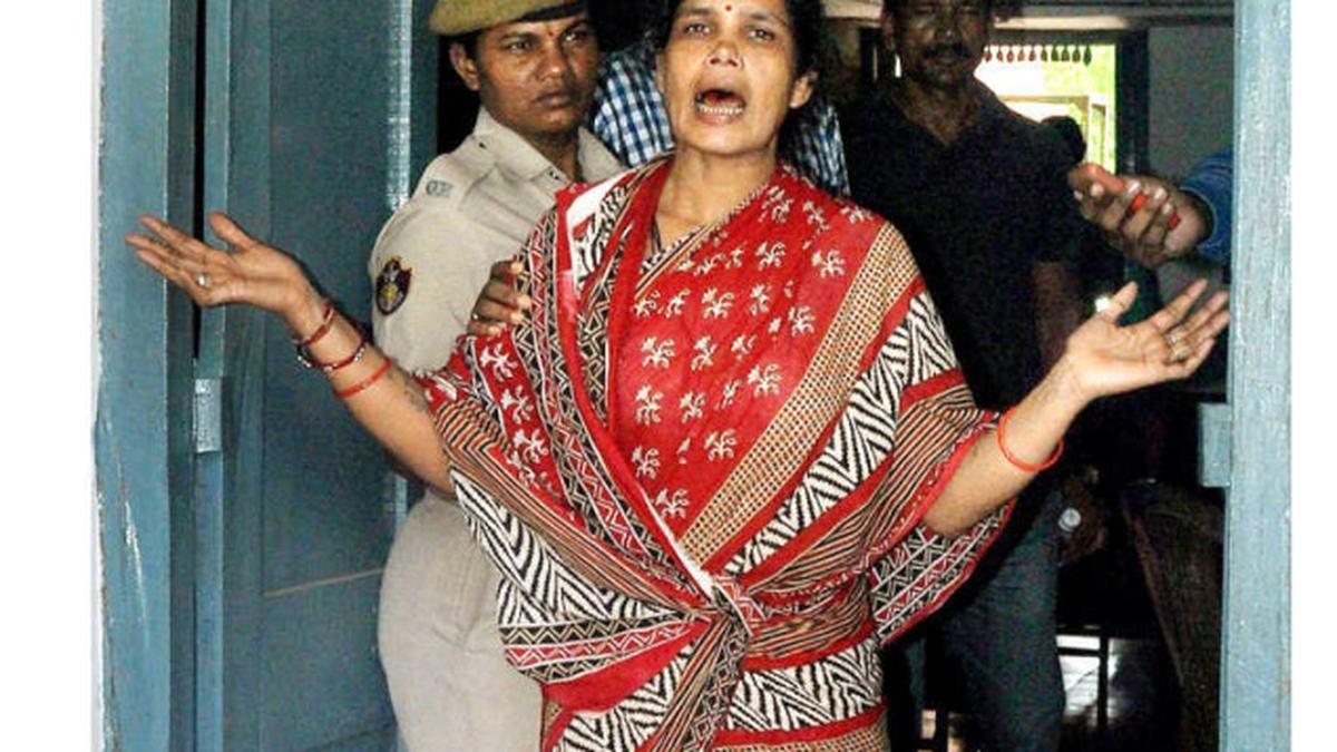 Woman who attacked police held - The Hindu