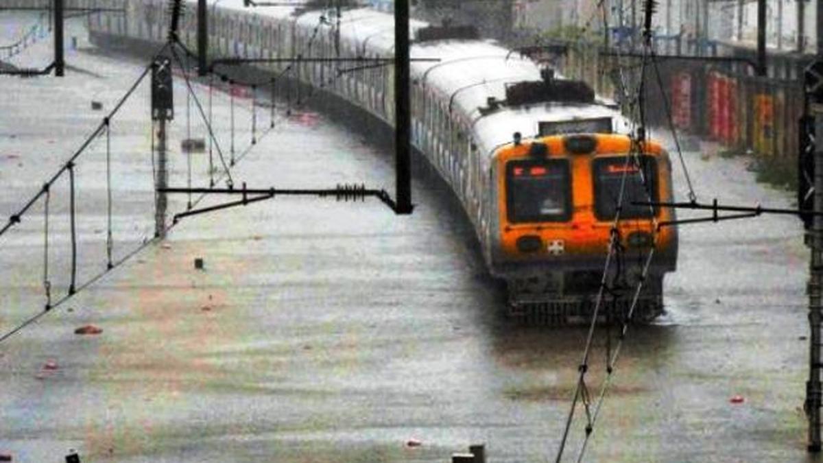 Mumbai braces for more downpour, train services restored - The Hindu