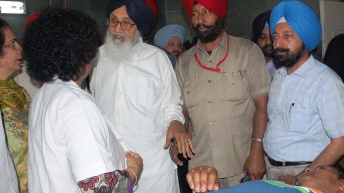 Badal meets family of martyr policeman - The Hindu