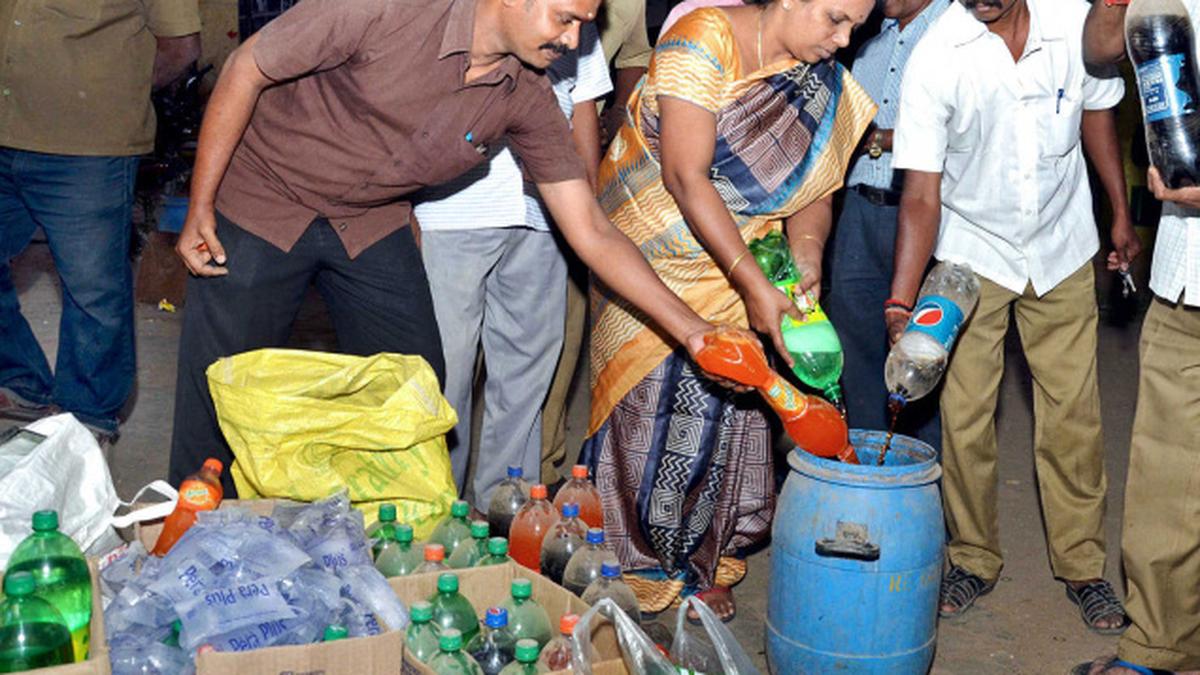 Officials destroy bottles of expired soft drinks - The Hindu