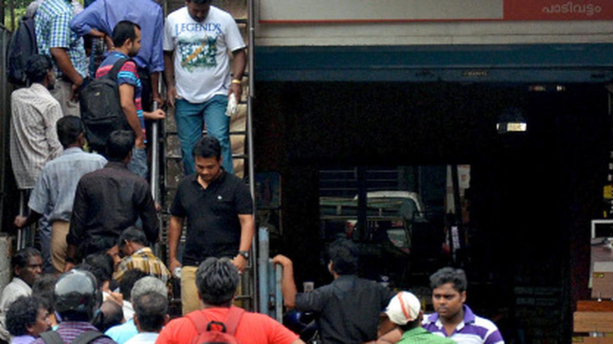 Bevco outlets open to long queues - The Hindu