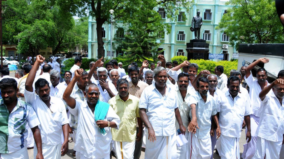 Farmers lay siege to PWD office, demand release of water - The Hindu