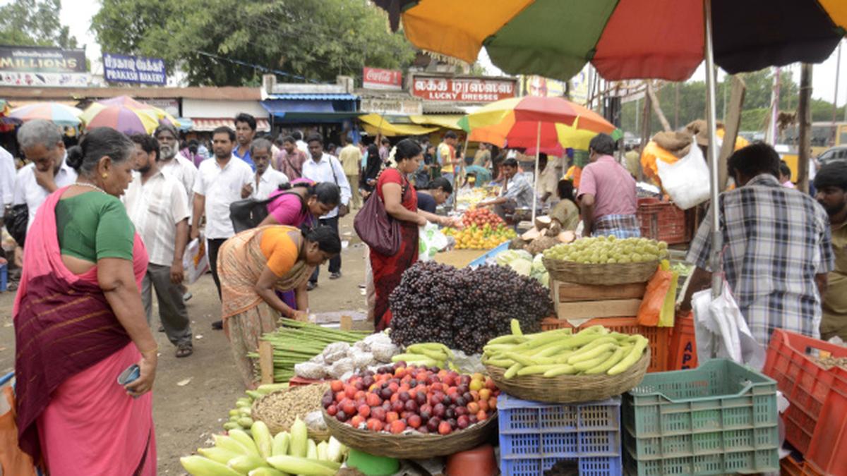 Rain interrupts life for hawkers - The Hindu