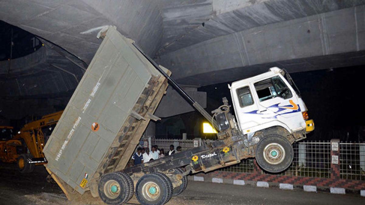 Lorry gets trapped under foot overbridge - The Hindu
