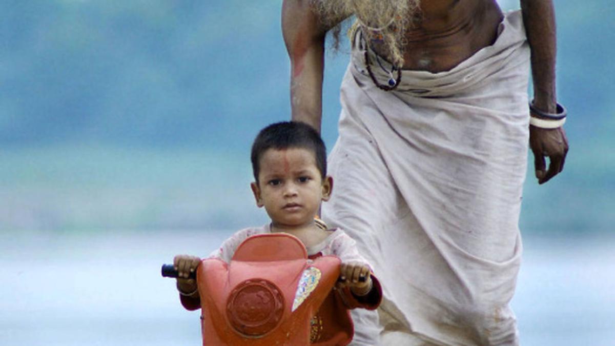 A sadhu and his son - The Hindu