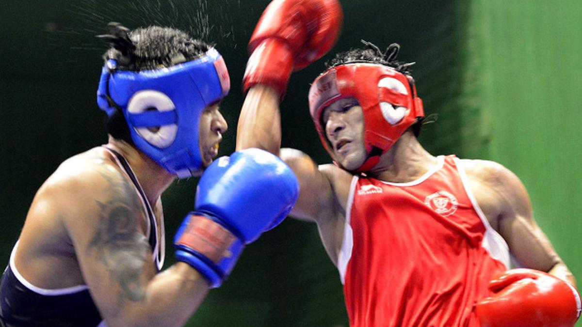 Dilbag Singh subdues a fighting Amit Karki - The Hindu