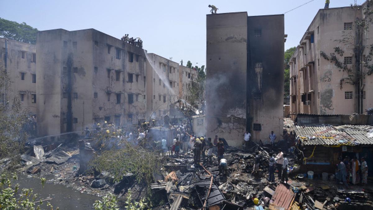 Fire in slum destroys huts on encroached land - The Hindu