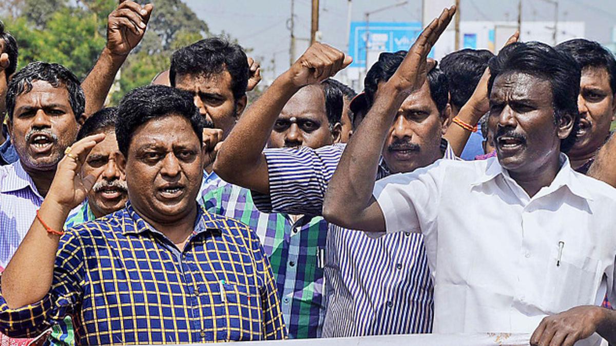 Govt. staff begin indefinite strike - The Hindu