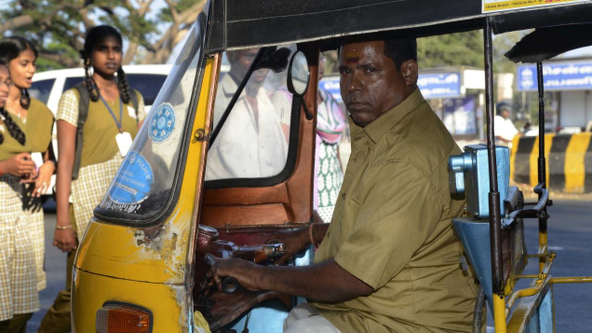 Auto driver K. Ravichandran helps a passenger showing signs of heart ...