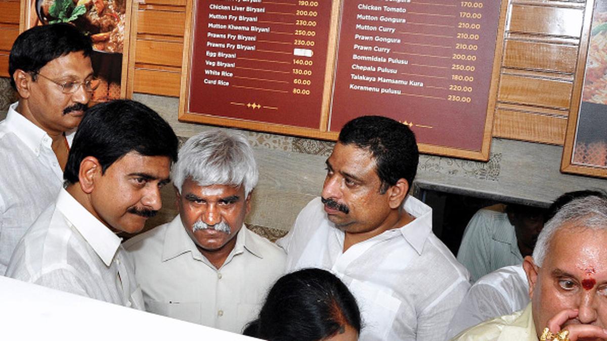 YSR’s close aide Sureedu seen with Minister Uma - The Hindu