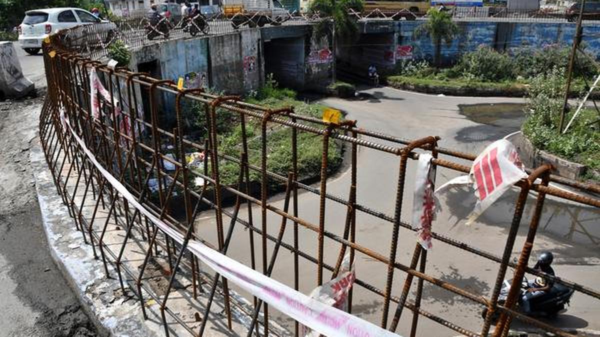 Highways Dept. reconstructing parapet walls on flyover - The Hindu