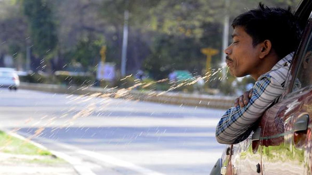 GHMC fines for spitting on road - The Hindu