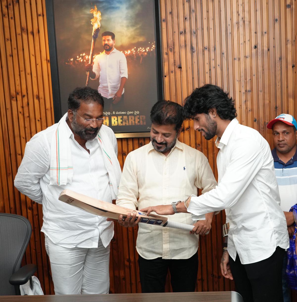 Asia Cup final hero Tilak Varma presents bat to Telangana CM Revanth ...