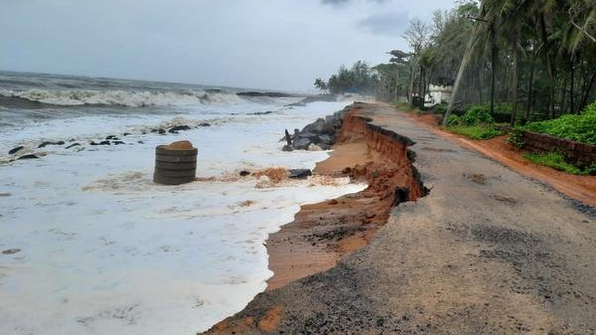 Sea washes away sand wall, may take road too - The Hindu