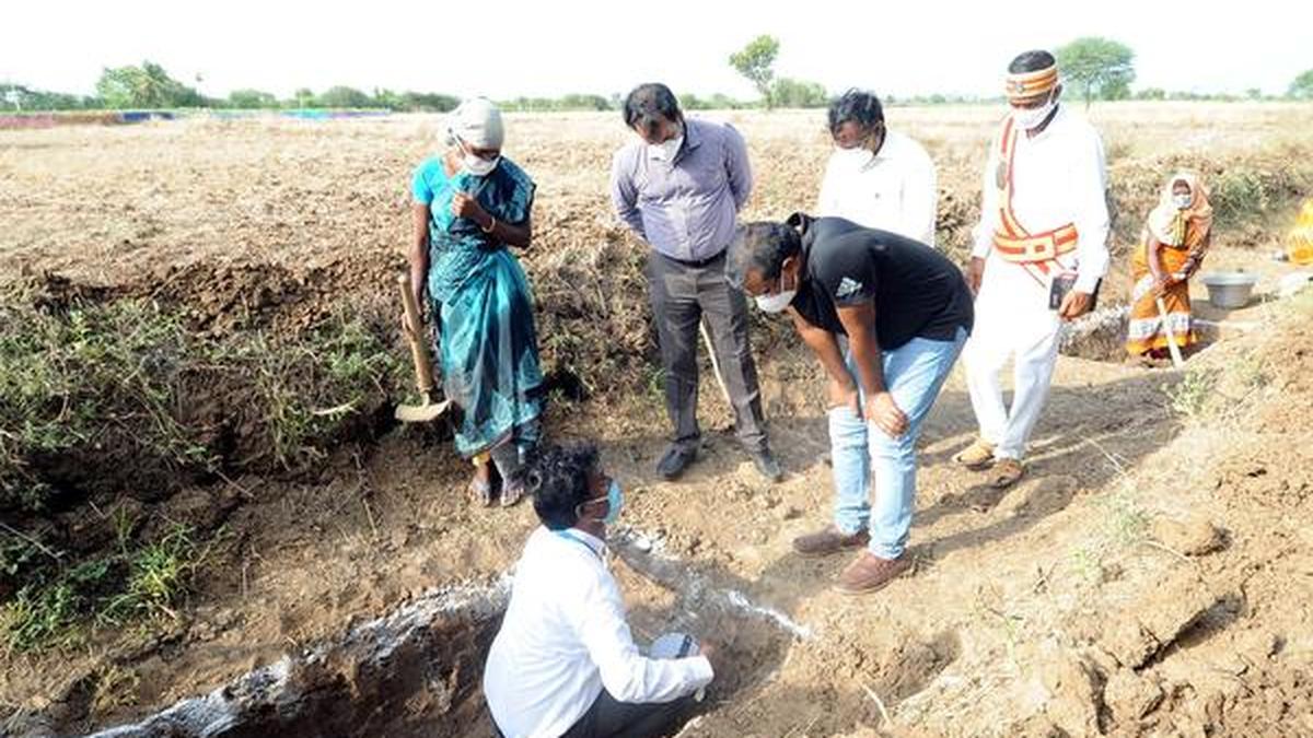 Digging of percolation pits on irrigation channels resented - The Hindu