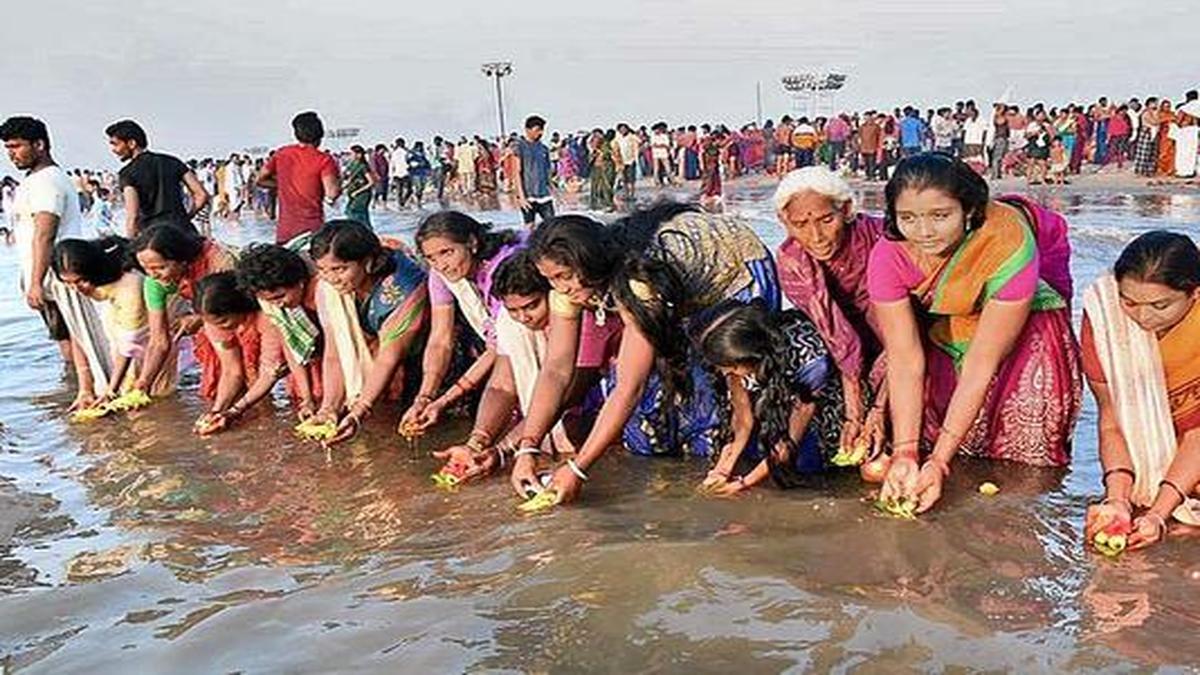 Sea of devotees throng beaches - The Hindu