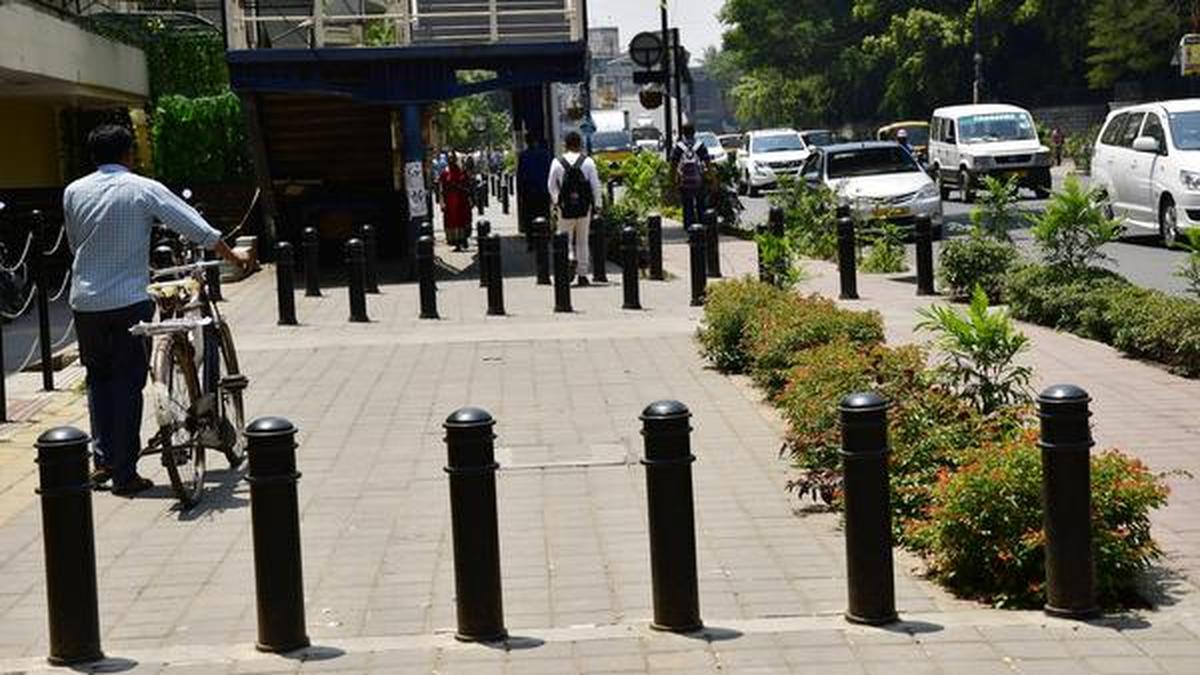 Bollards missing from footpath on Mission Road - The Hindu