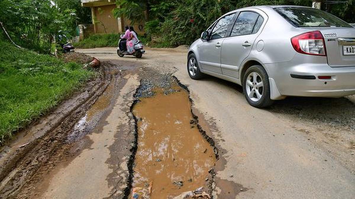 Rain worsens pothole-ridden and dug-up roads - The Hindu