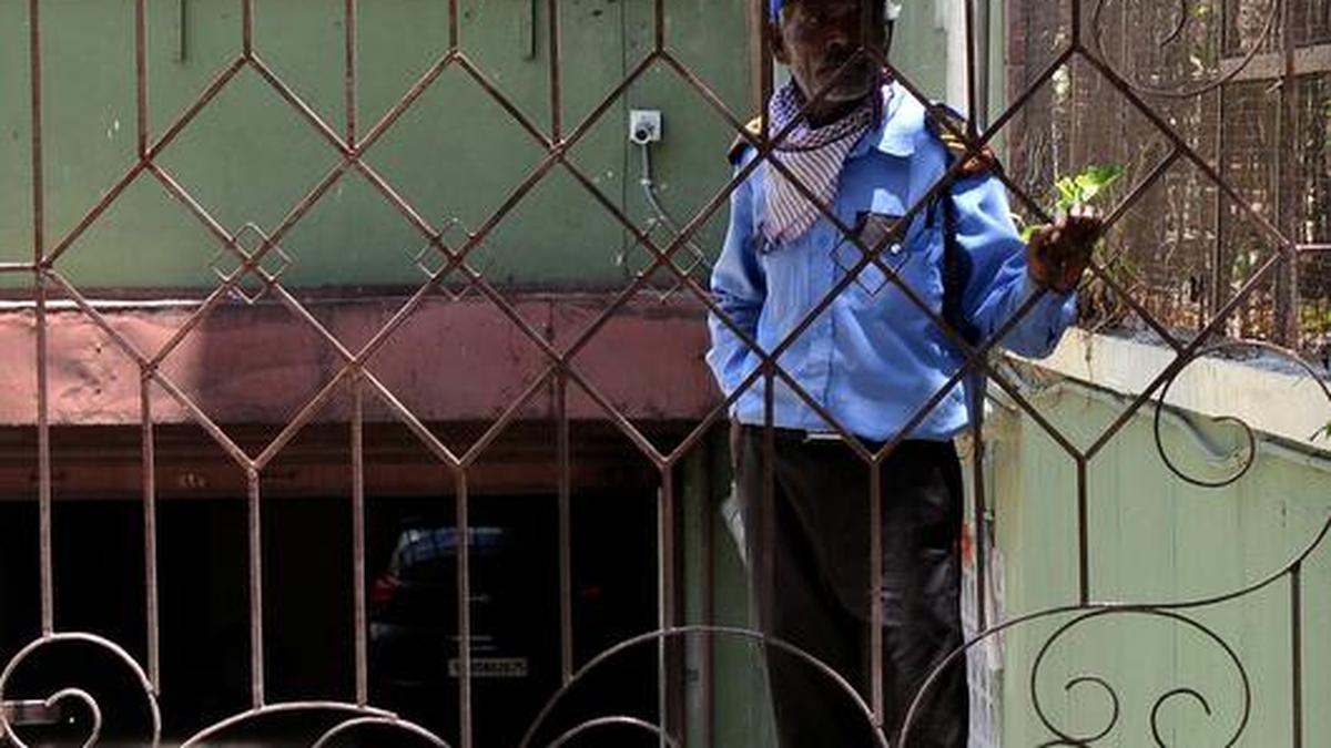 Security guards enforce social distancing in city apartments - The Hindu