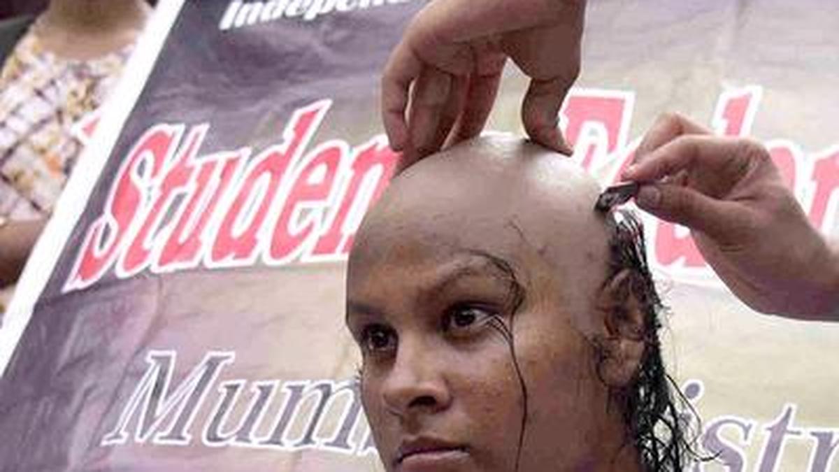 Students shave heads to protest delay in results - The Hindu
