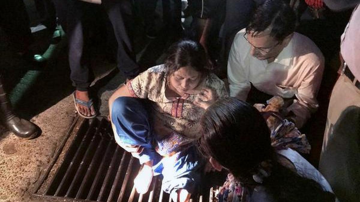 Woman’s leg gets stuck in partially-covered drain - The Hindu