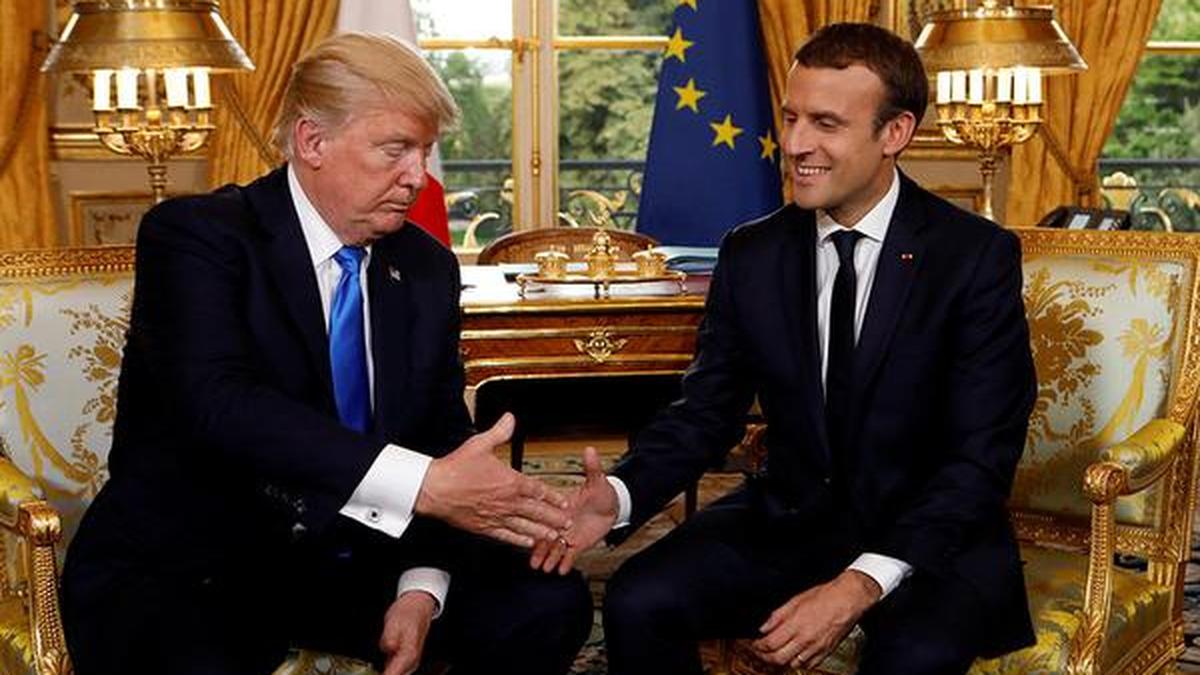 Smiles replace grimaces as Macron welcomes Trump - The Hindu