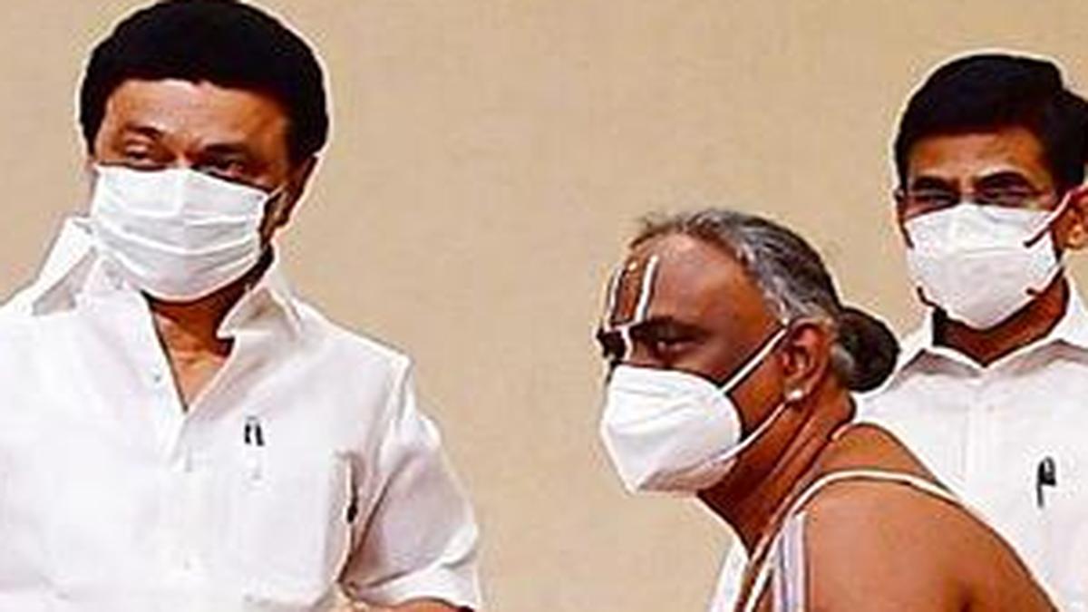 Stalin distributes uniforms to staff, priests of temples - The Hindu