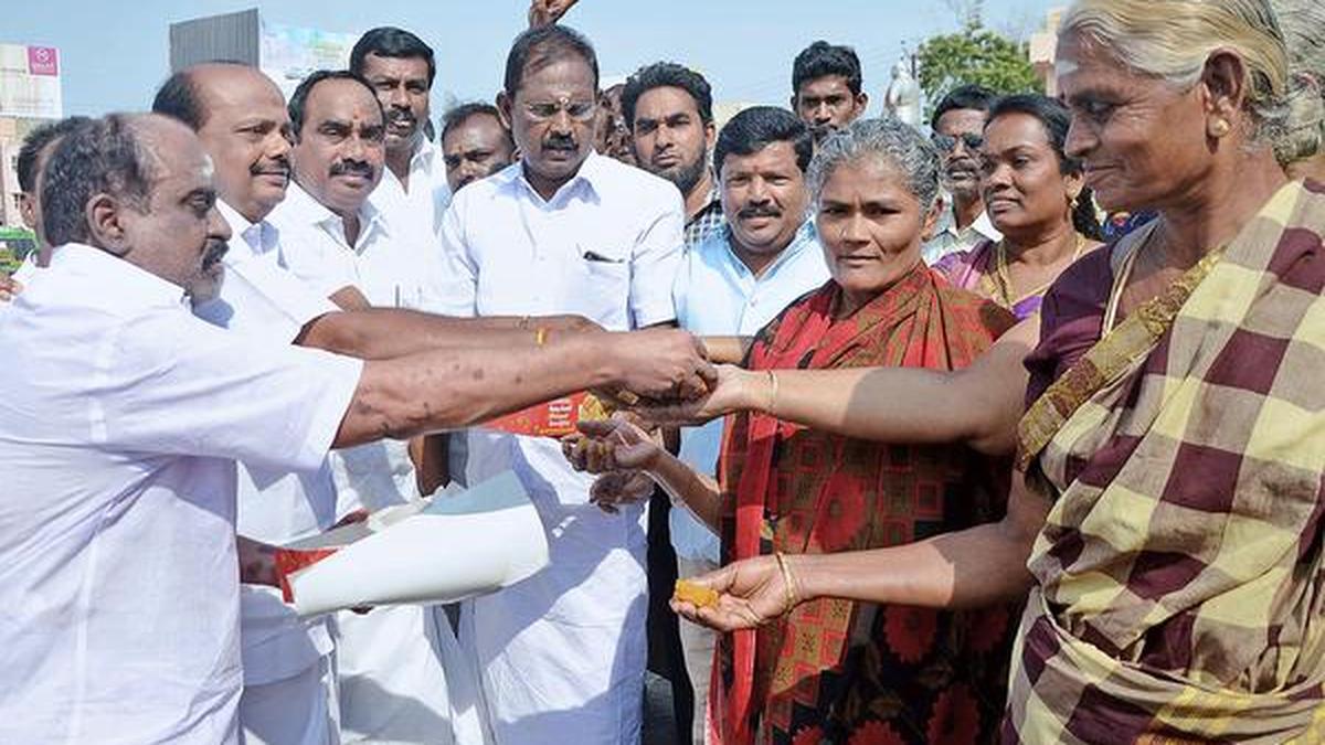 AIADMK men celebrate winning of two leaves symbol - The Hindu