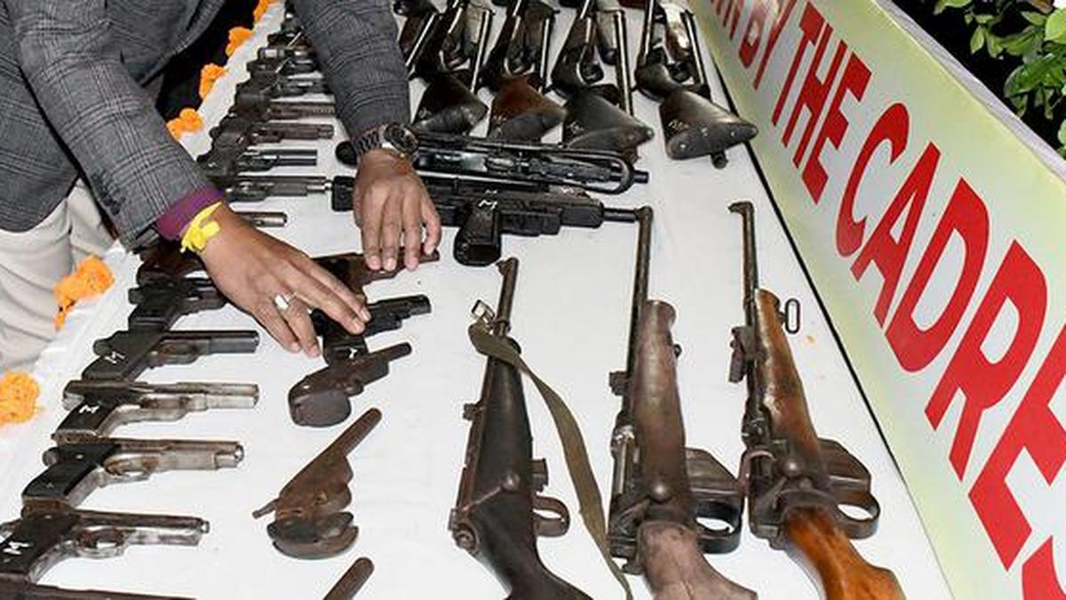 Tribal militant outfit chief, cadres surrender weapons in Assam - The Hindu