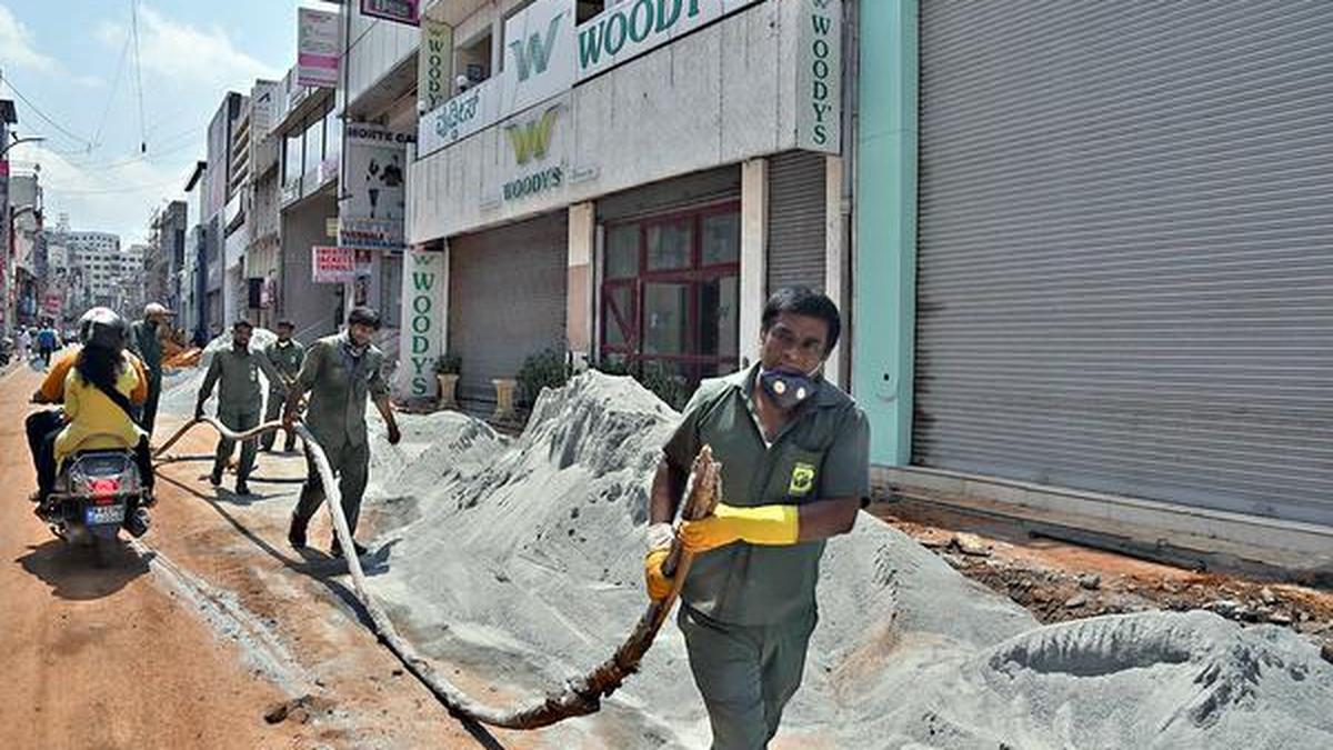 Residents find power cable passing through overflowing manhole in ...